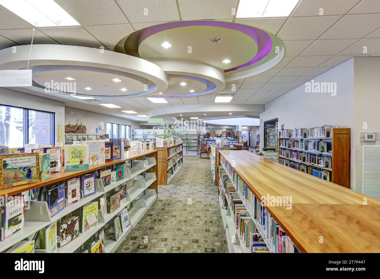 Shelves filled with books surrounding a quiet reading area in the ...