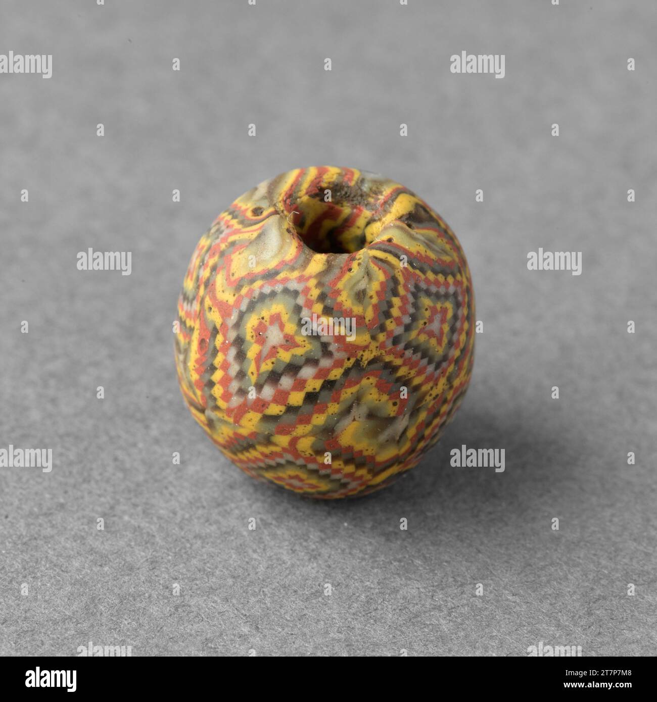 Ancient roman glass mosaic bead Stock Photo - Alamy