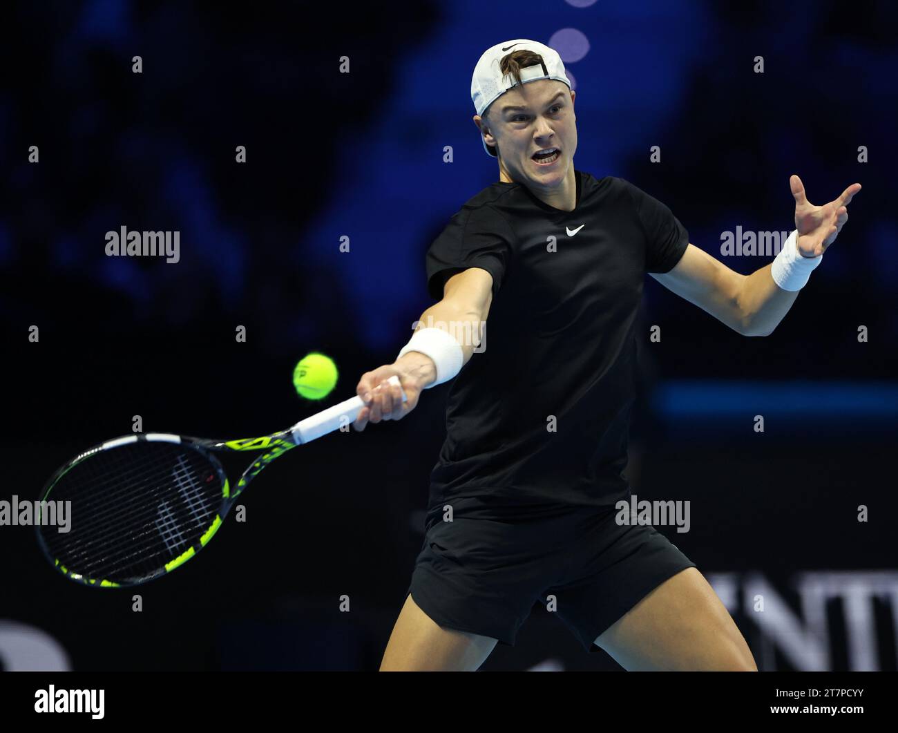 Turin, Italy. 16th Nov, 2023. Holger Rune hits a return during the group stage match between ...