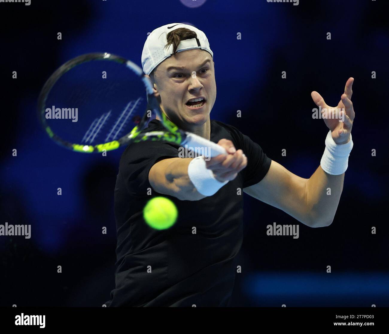 Turin, Italy. 16th Nov, 2023. Holger Rune hits a return during the group stage match between ...