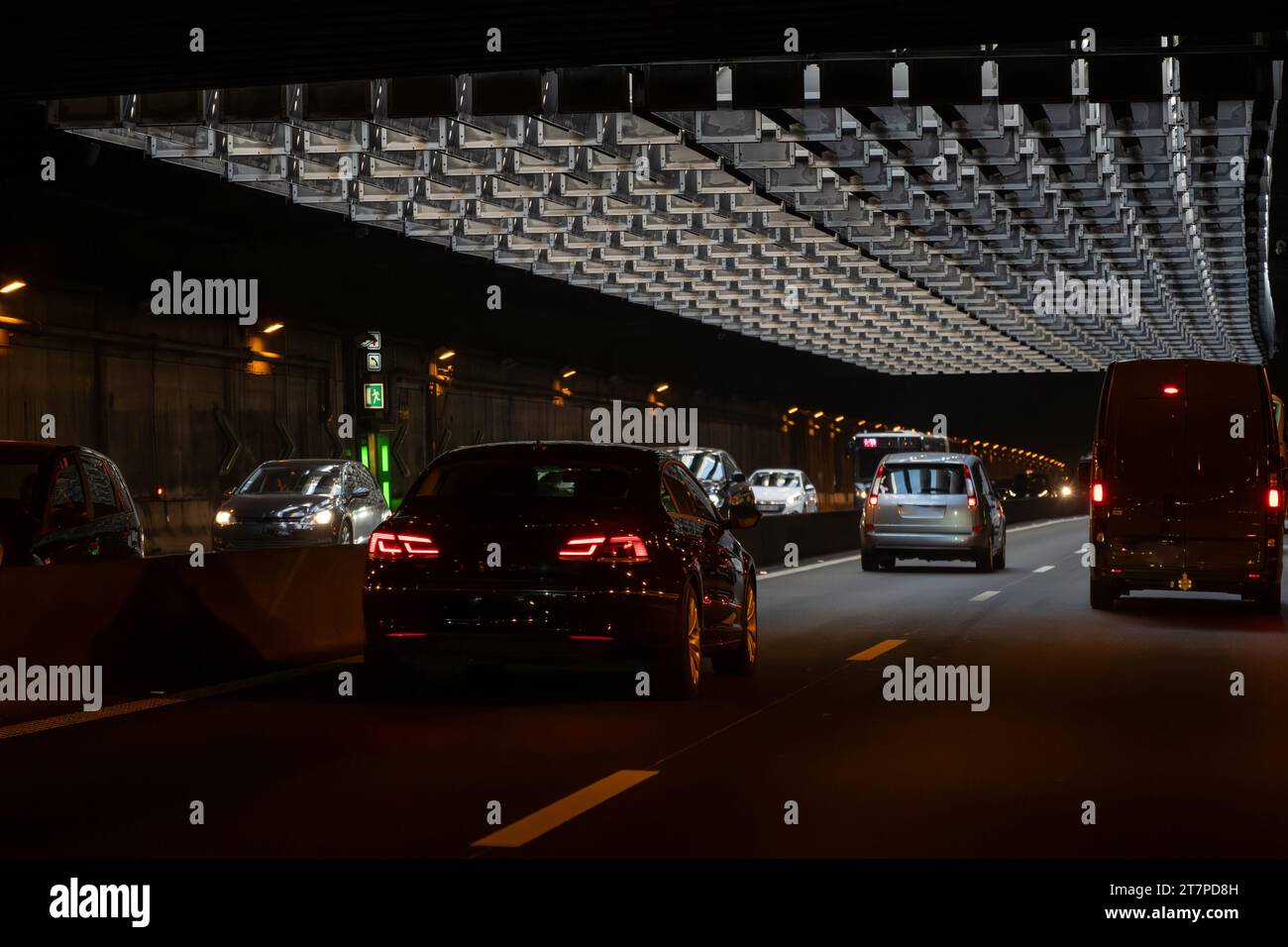 Driving in tunnel in heavy traffic on ring road of capital of France ...