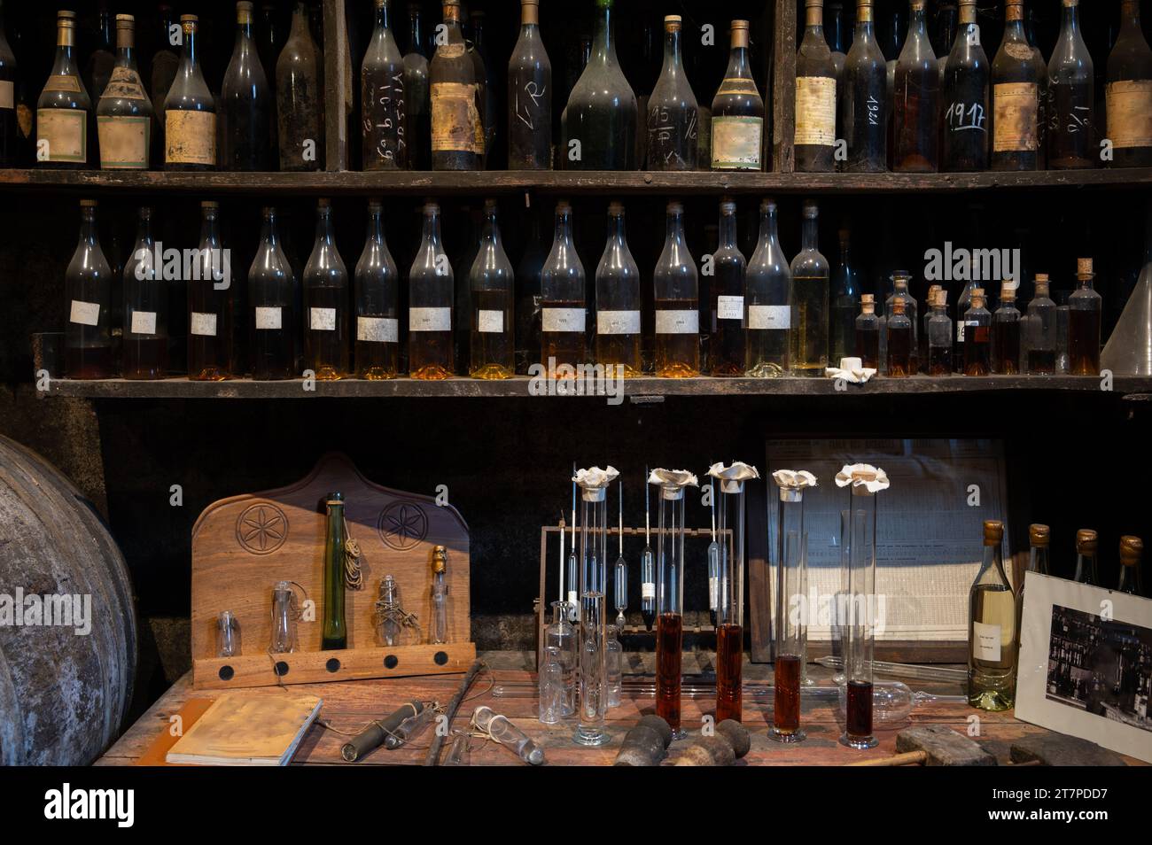 Blending process of cognac spirit and old dark French oak barrels in ...