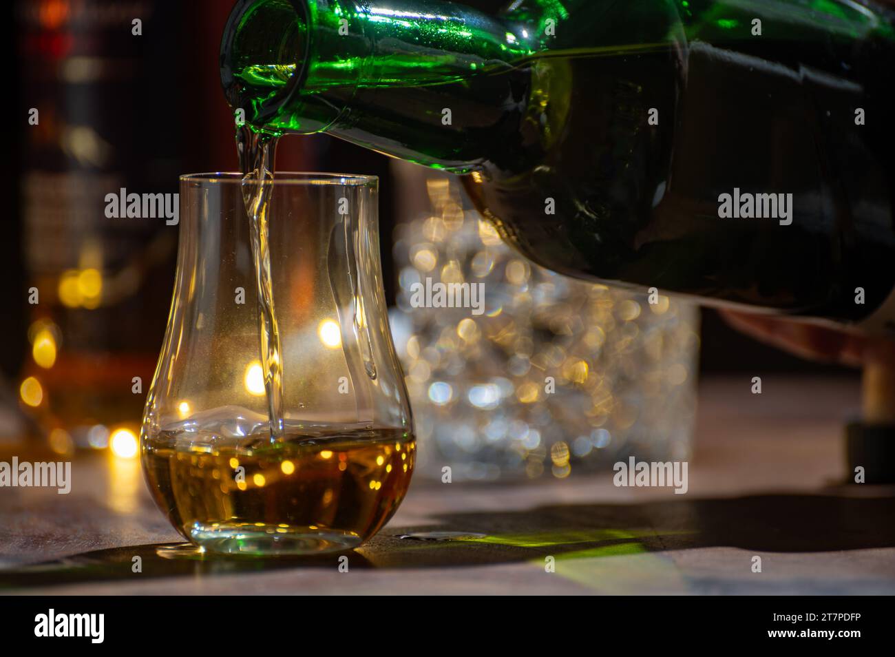 Pouring in Speyside whisky glass of whisky, glasses of single malt and ...