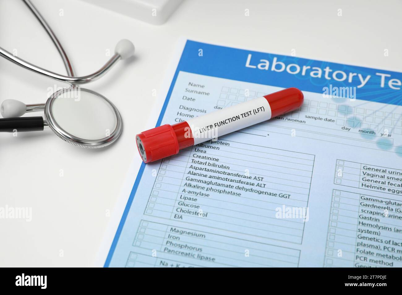 Liver Function Test. Tube with blood sample, form and stethoscope on ...