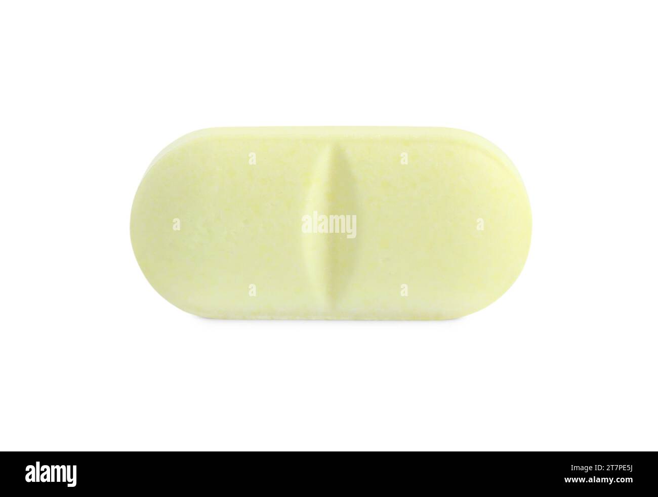 One yellow pill isolated on white. Medicinal treatment Stock Photo - Alamy