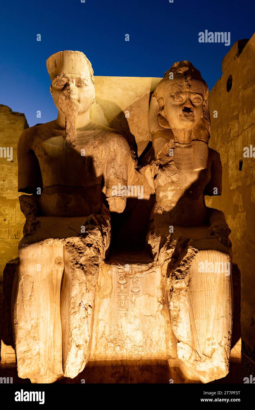 Night view of the statues columns and hieroglyphics of the ...
