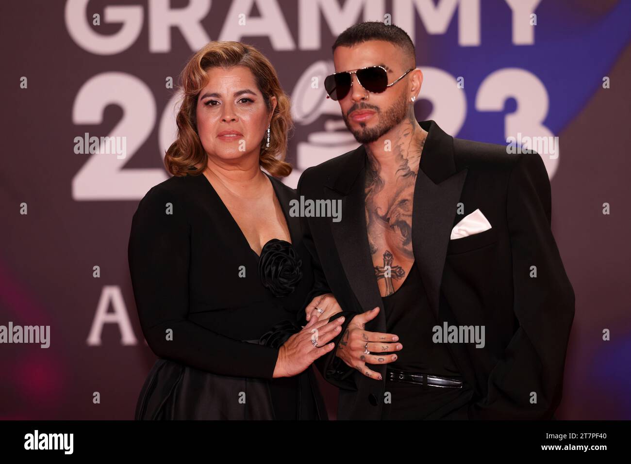 Maria Nelly Ruiz, left, and Rauw Alejandro arrive at the 24th annual ...
