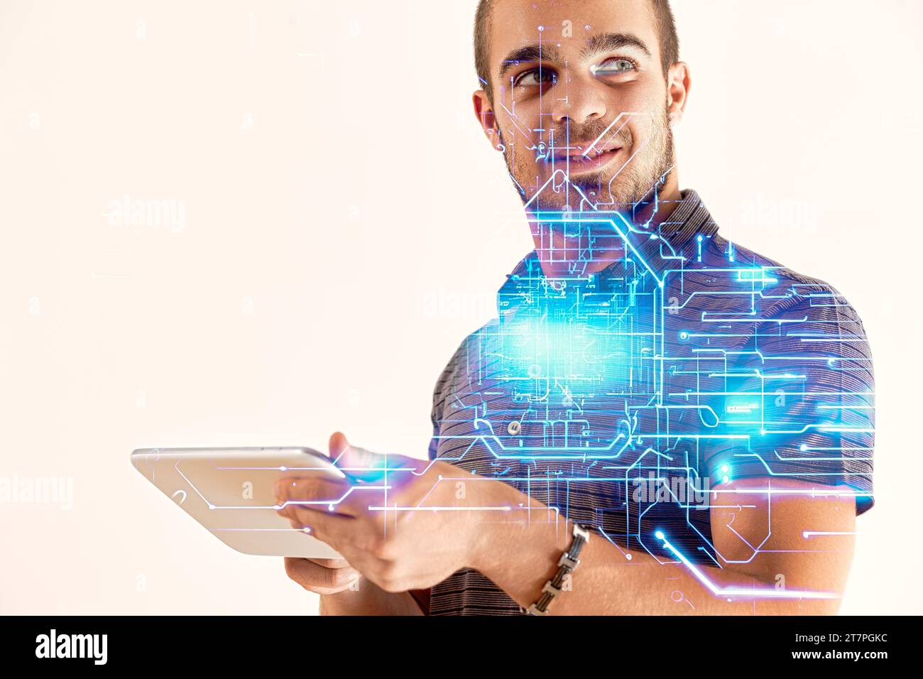 Digital world and reality converge in a man’s tablet interaction Stock ...