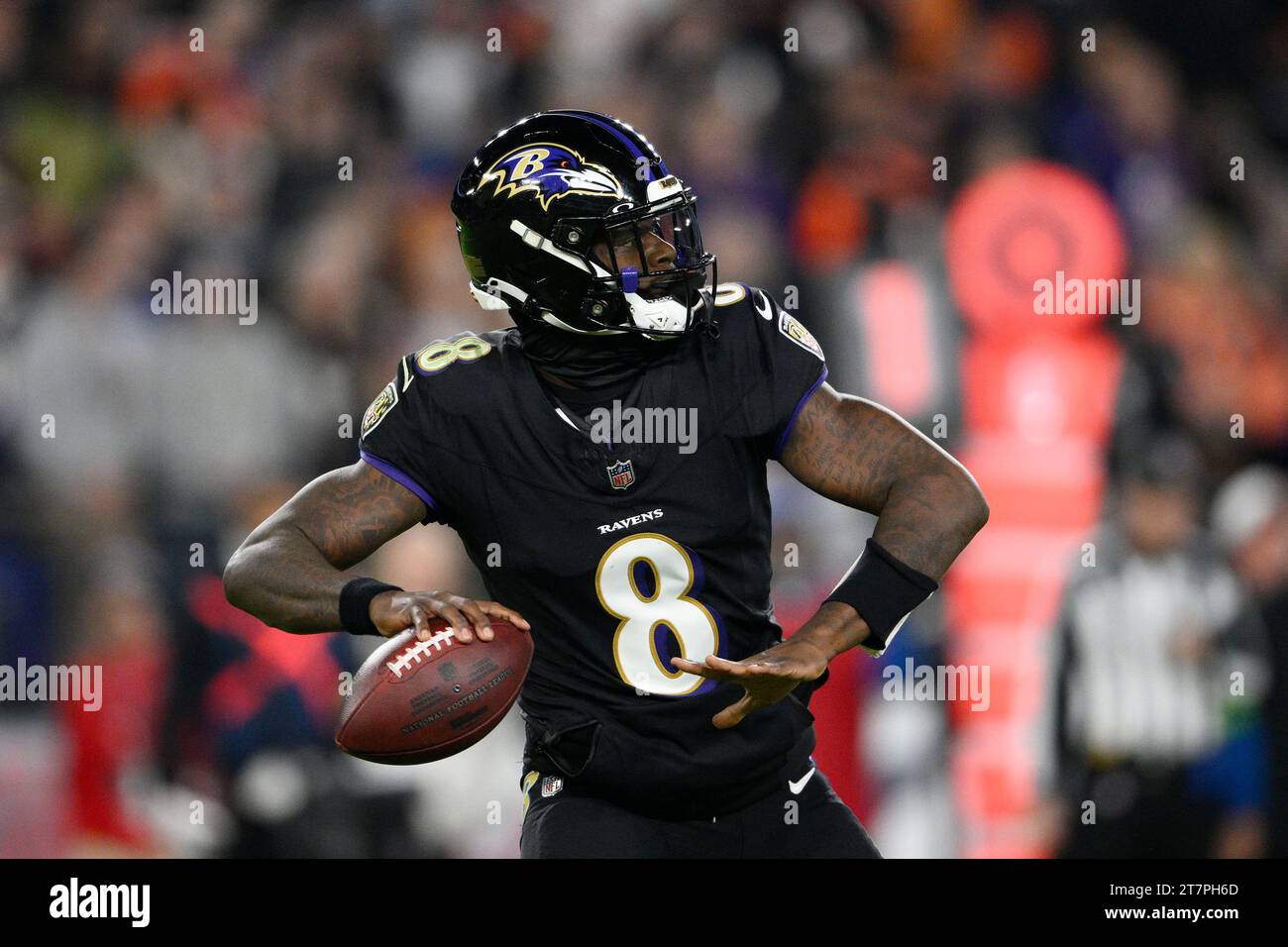 Baltimore Ravens quarterback Lamar Jackson (8) sets back to pass in the ...