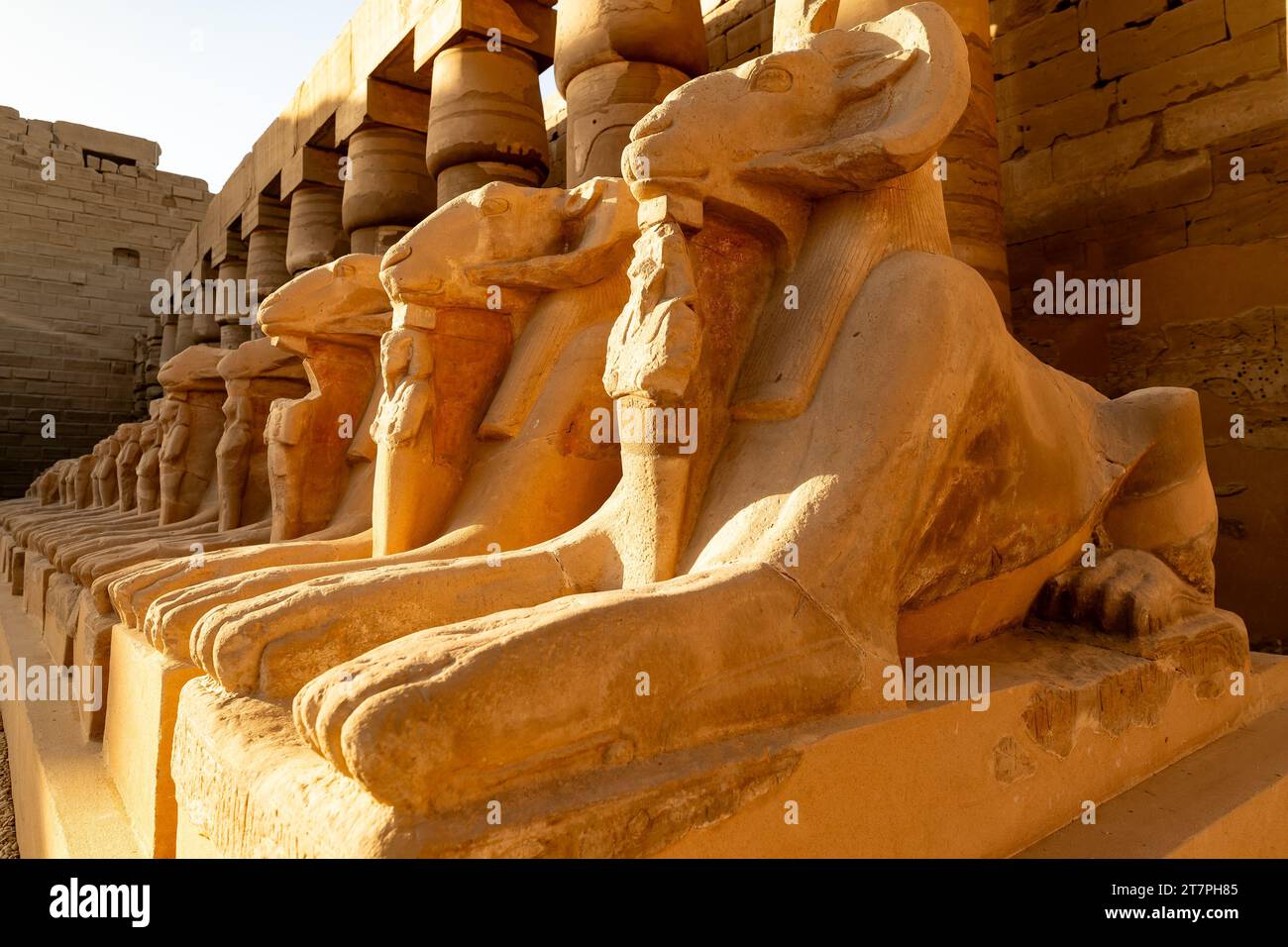 Large stone sphinx statue in the ancient ruins of Karnak Temple complex ...