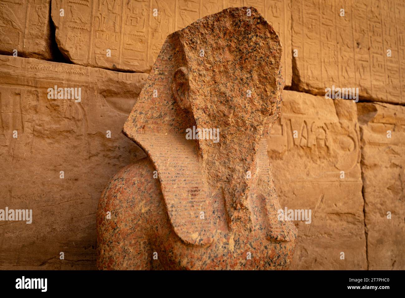 Large stone pharo statue in the ancient ruins of Karnak Temple complex ...