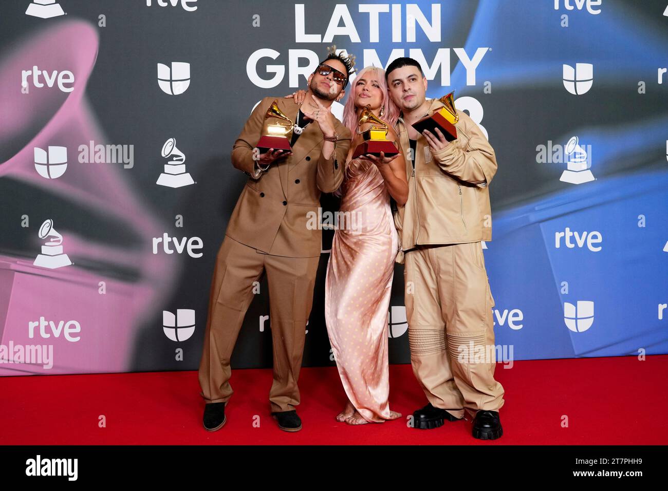 Ovy On The Drums, from left, Karol G, and Kevyn Mauricio Cruz pose with ...