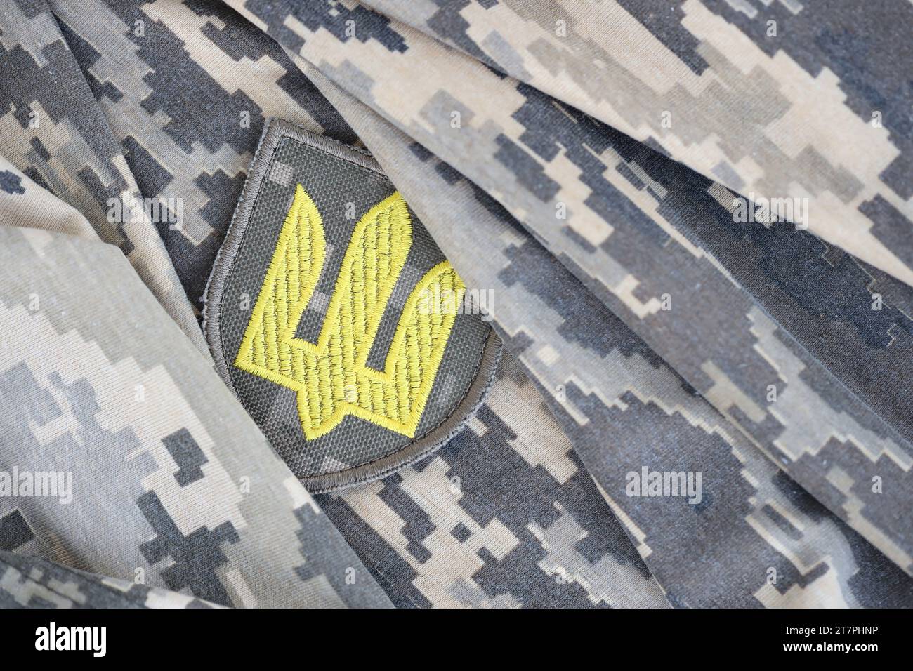 Symbol of Ukrainian army on the camouflage uniform of a Ukrainian ...