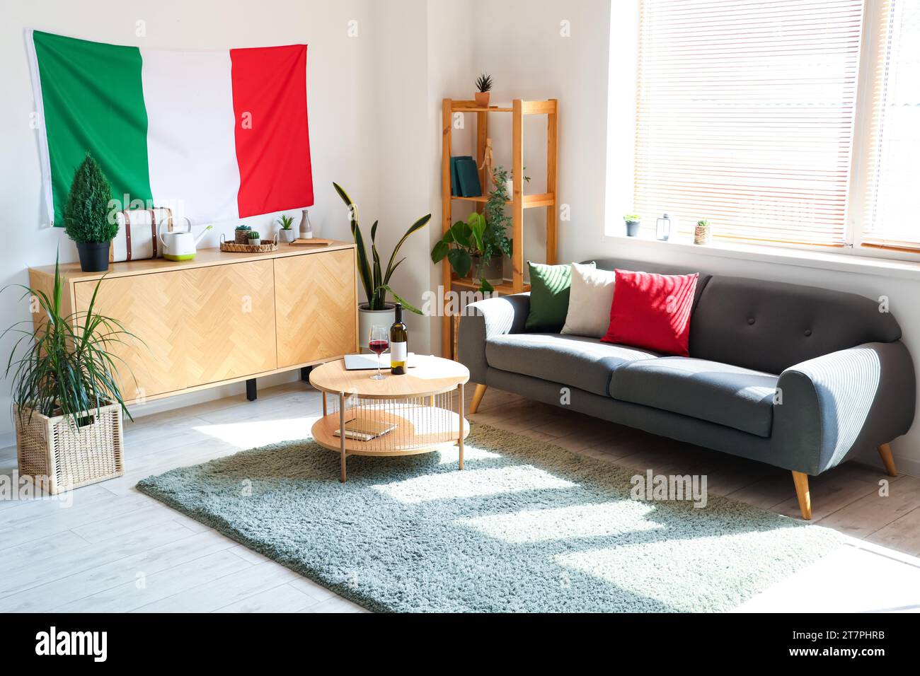 Interior of stylish living room with hanging Italian flag Stock Photo ...