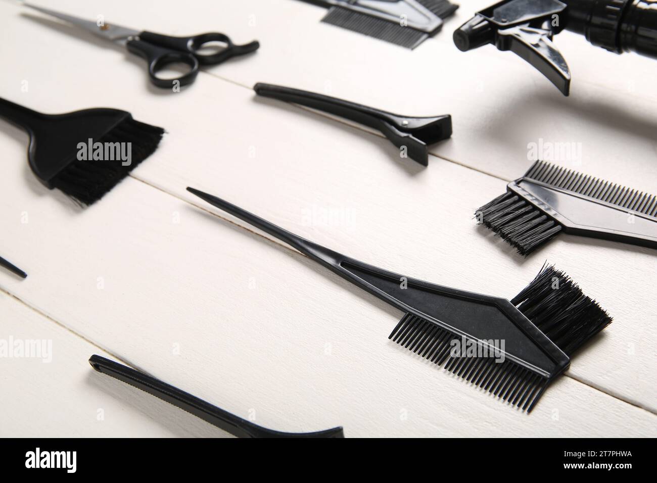 Set of hairdresser's tools on white wooden background Stock Photo - Alamy