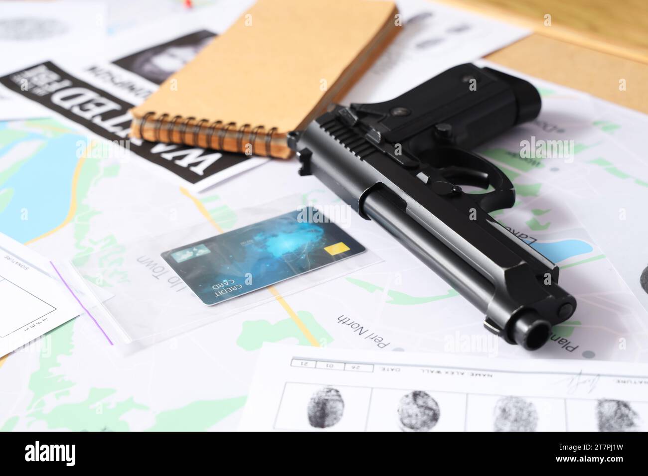 Gun with clues on table of FBI agent in office, closeup Stock Photo - Alamy