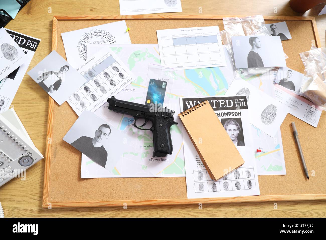 Table with clues of FBI agent in office, top view Stock Photo - Alamy