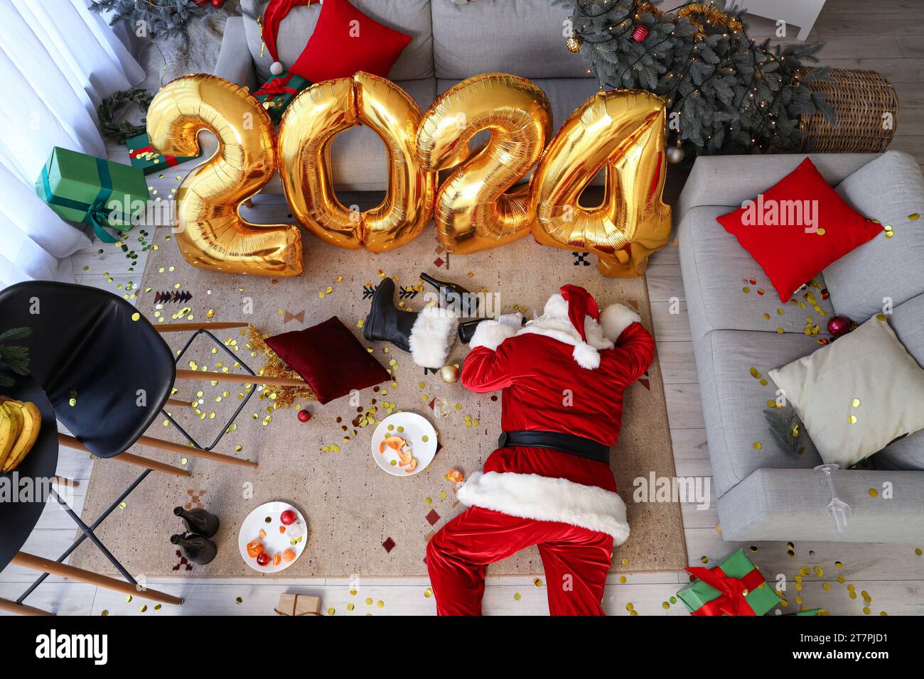 Drunk Santa Claus lying in messy living room after New Year party, top ...