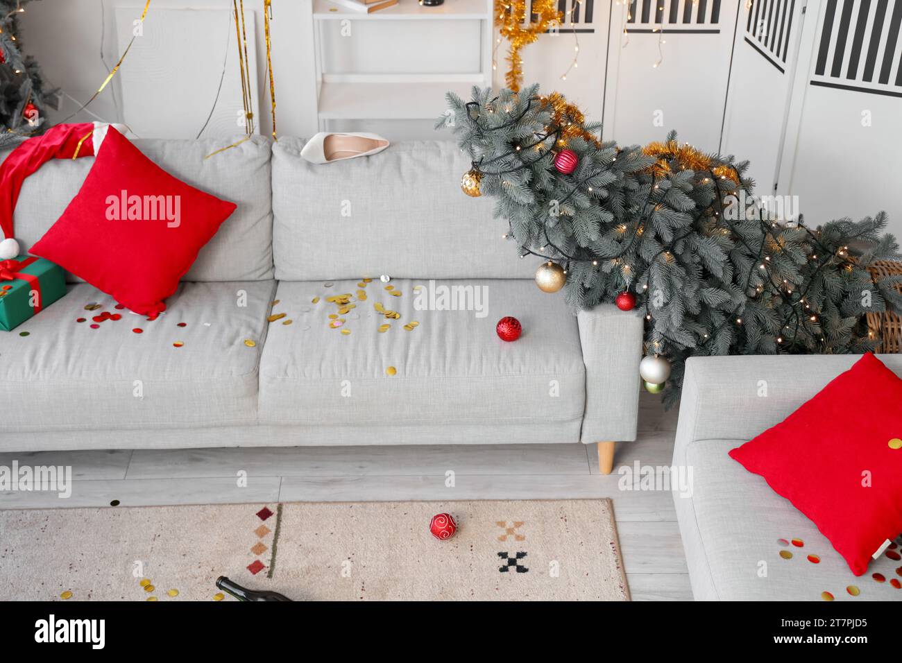 Interior of messy living room after New Year party with fallen ...