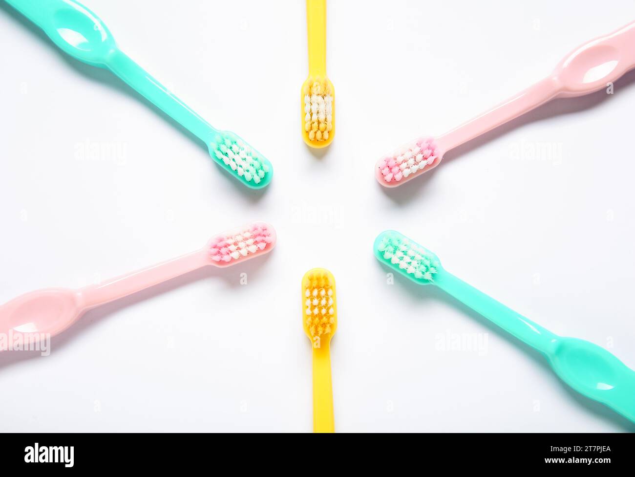 Colorful plastic toothbrushes on white background Stock Photo - Alamy