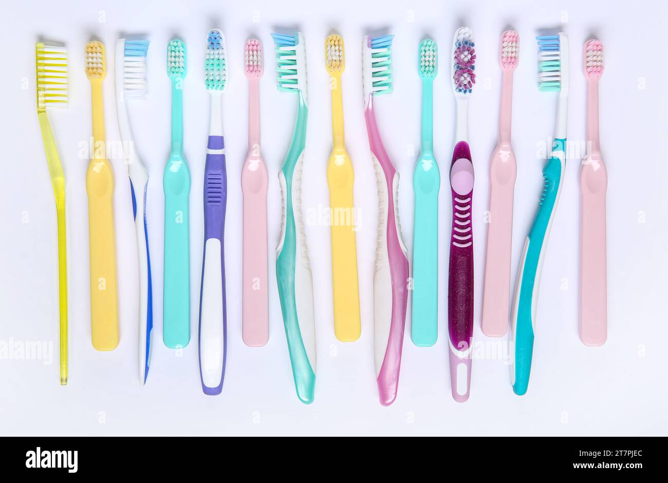 Colorful plastic toothbrushes on white background Stock Photo - Alamy