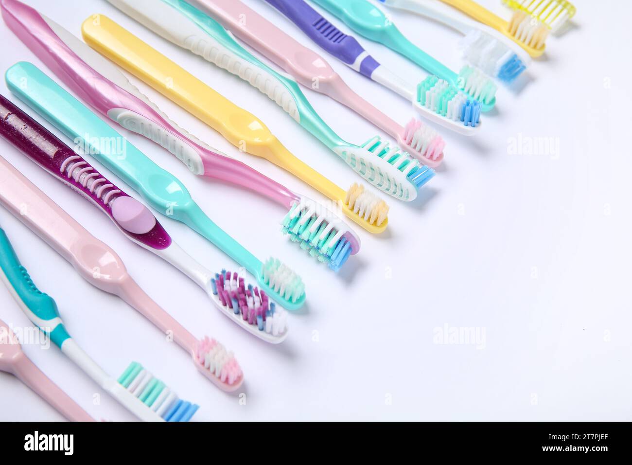 Colorful plastic toothbrushes on white background Stock Photo - Alamy