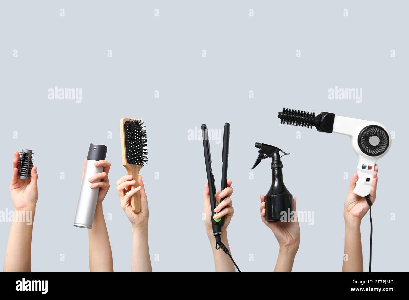 Many female hands with hair supplies on white background Stock Photo ...