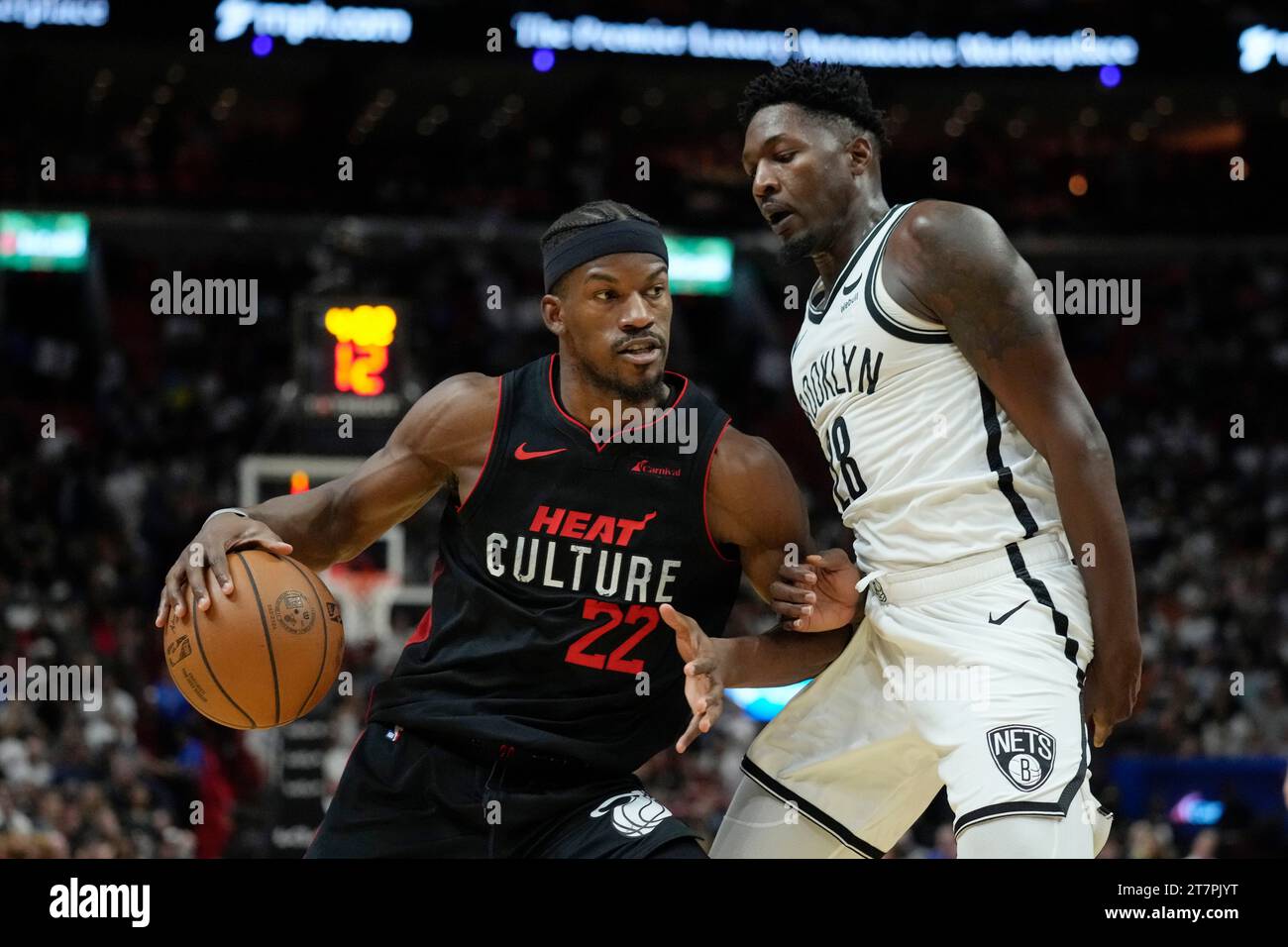 Miami Heat forward Jimmy Butler (22) pushes past Brooklyn Nets forward ...