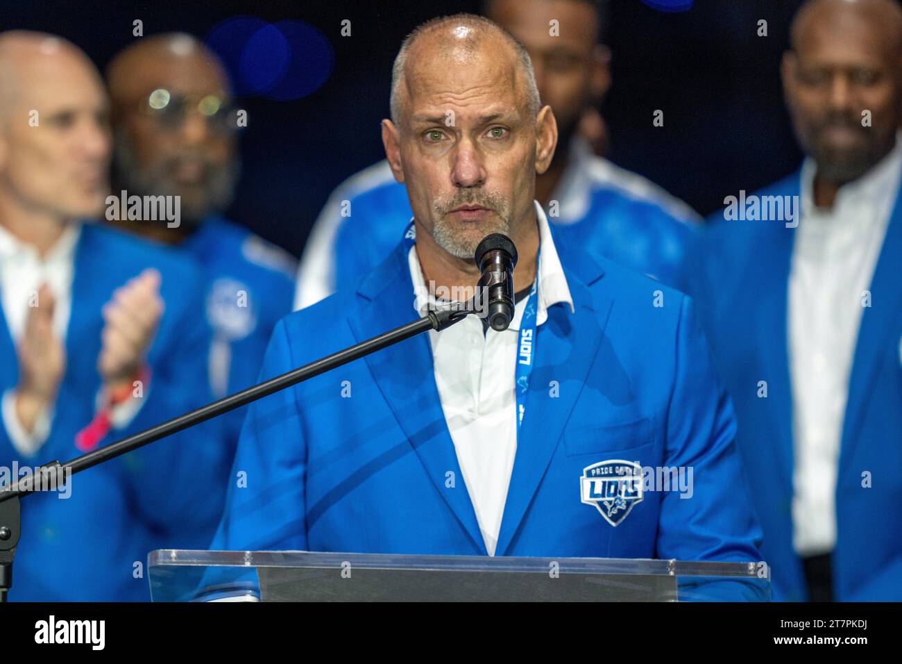 Detroit Lions alumnus Chris Spielman speaks behind the podium at the ...