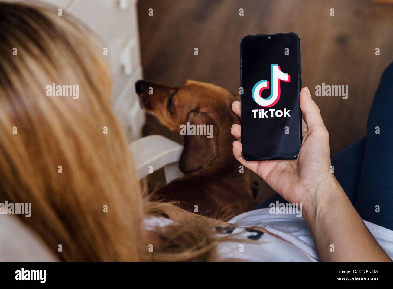 Tiktok on mobile phone Screen. Woman holding a Smart Phone with Tik Tok ...