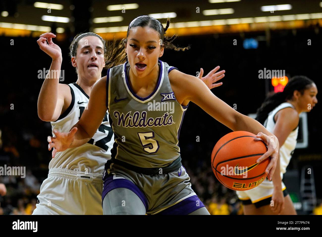 Kansas State guard Brylee Glenn (5) drives around Iowa guard Caitlin ...