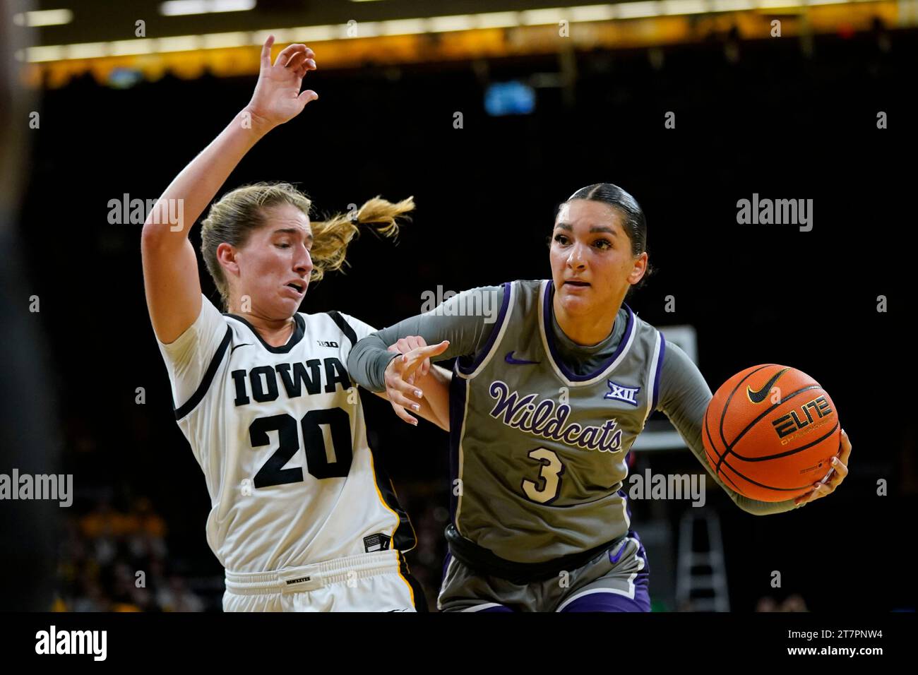 Kansas State guard Jaelyn Glenn (3) drives past Iowa guard Kate Martin ...