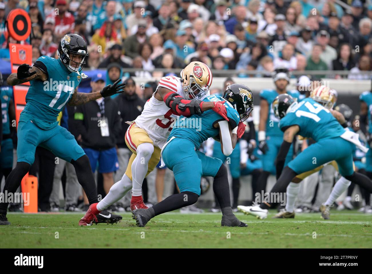 San Francisco 49ers linebacker Dre Greenlaw (57) tackles Jacksonville Jaguars running back ...