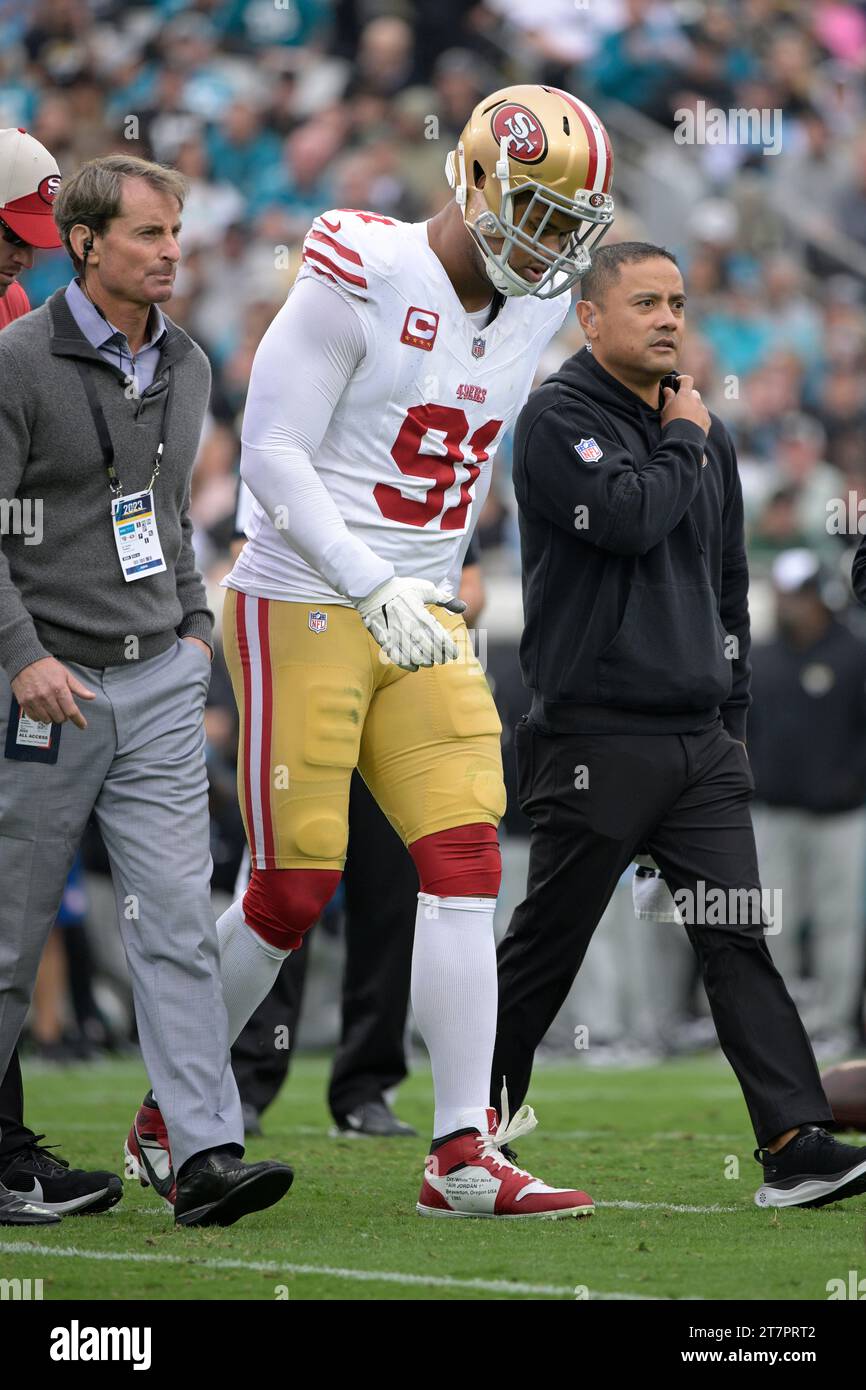 San Francisco 49ers defensive end Arik Armstead (91) is helped off of ...