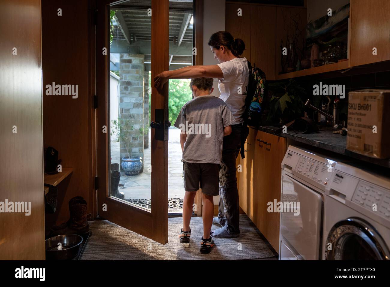 Meredith Ellis, right, takes her son, GC, 6, to school as they leave ...