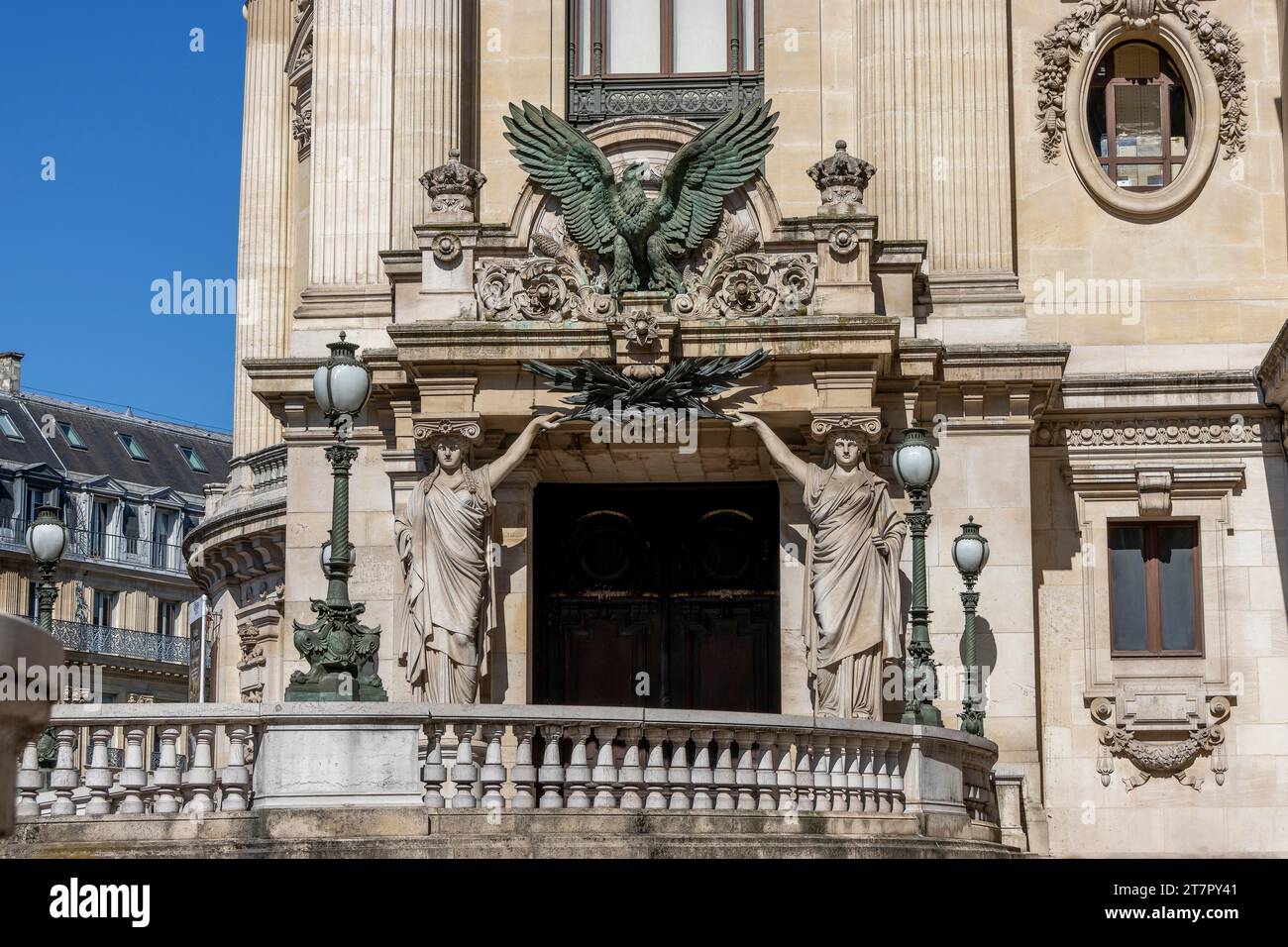 The opulent entrance to the Palais Garnier opera house with caryatids ...