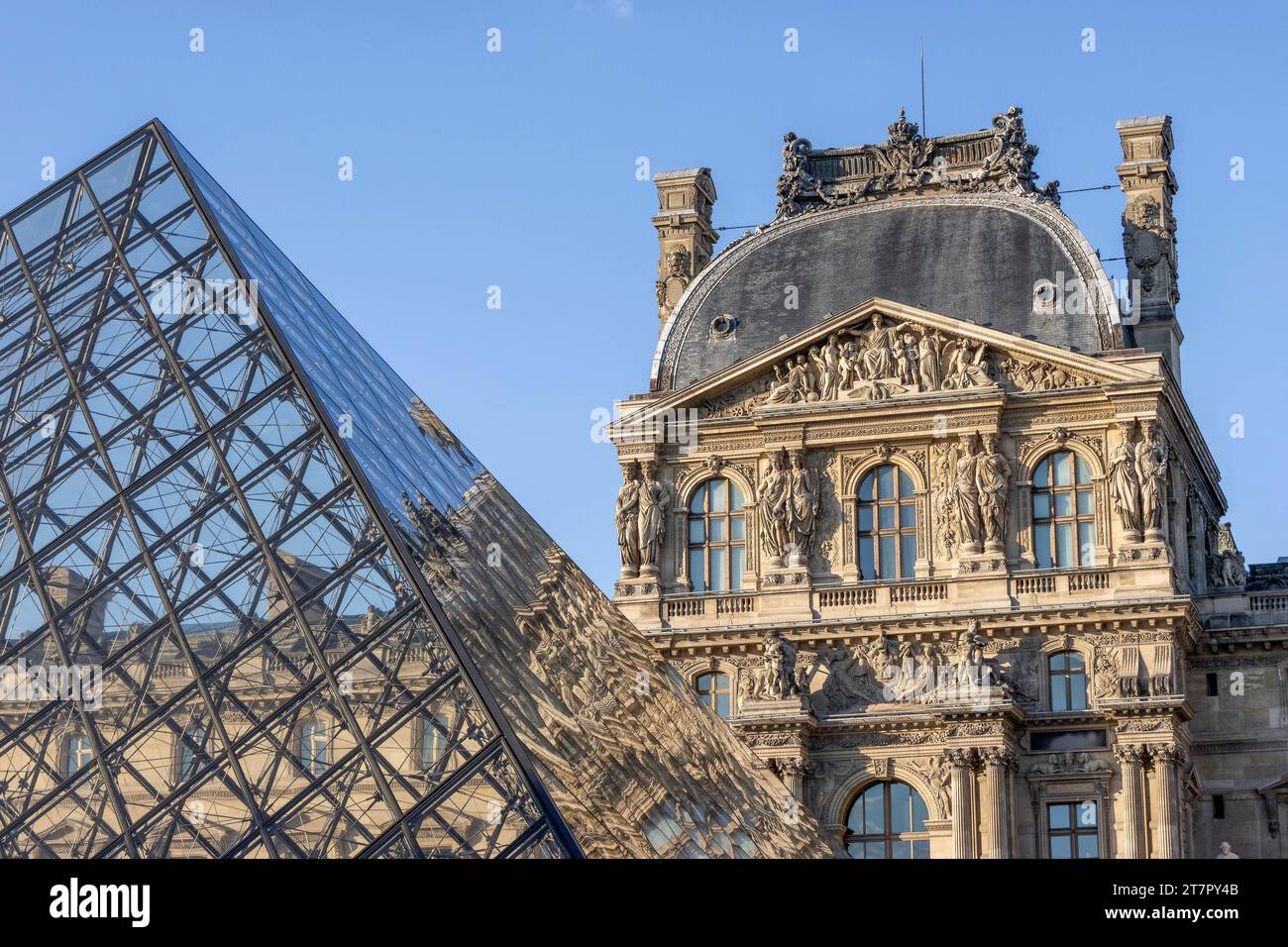 Detail of the Louvre Museum building with reflection on the glass ...