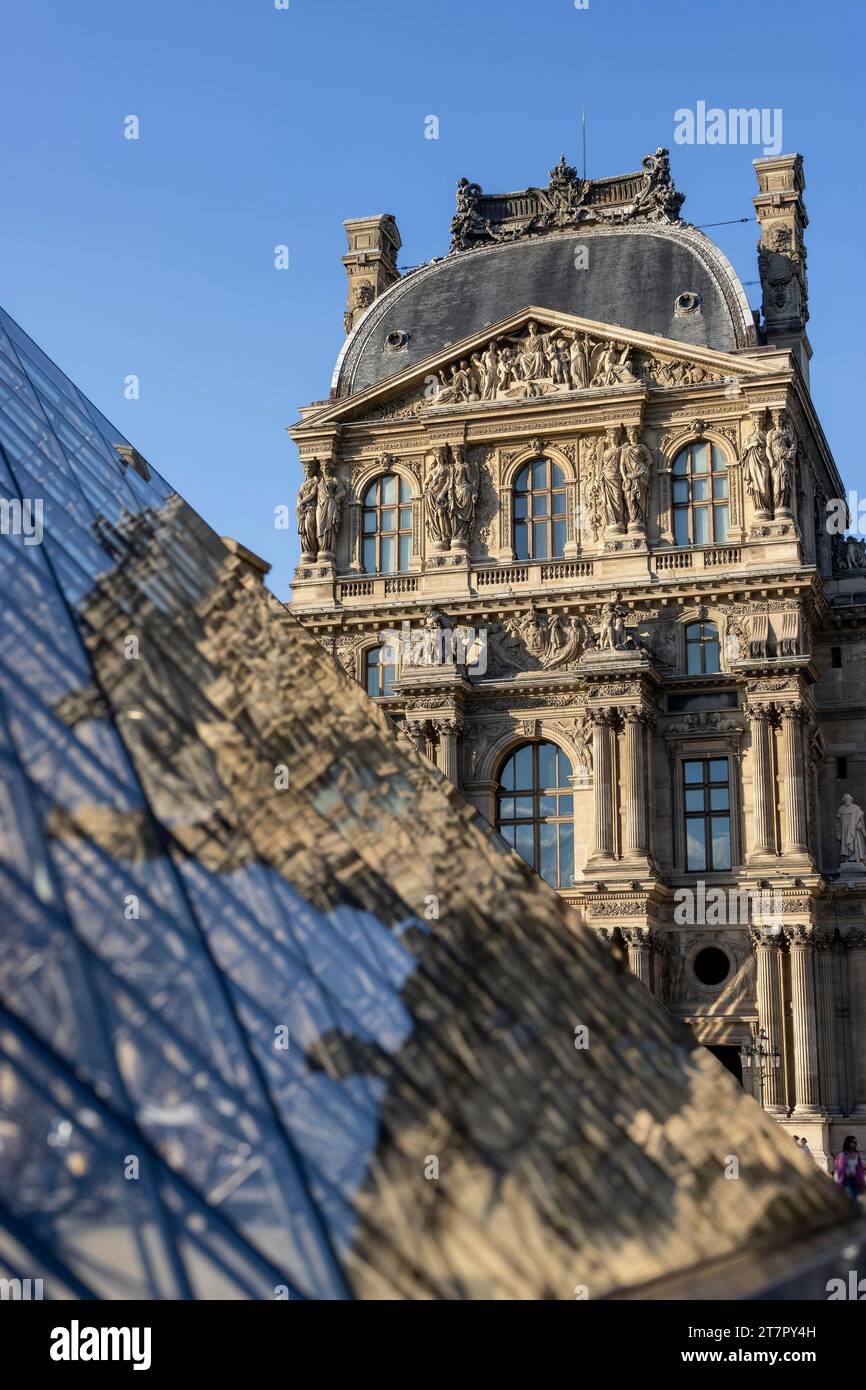 Detail of the Louvre Museum building with reflection on the glass ...