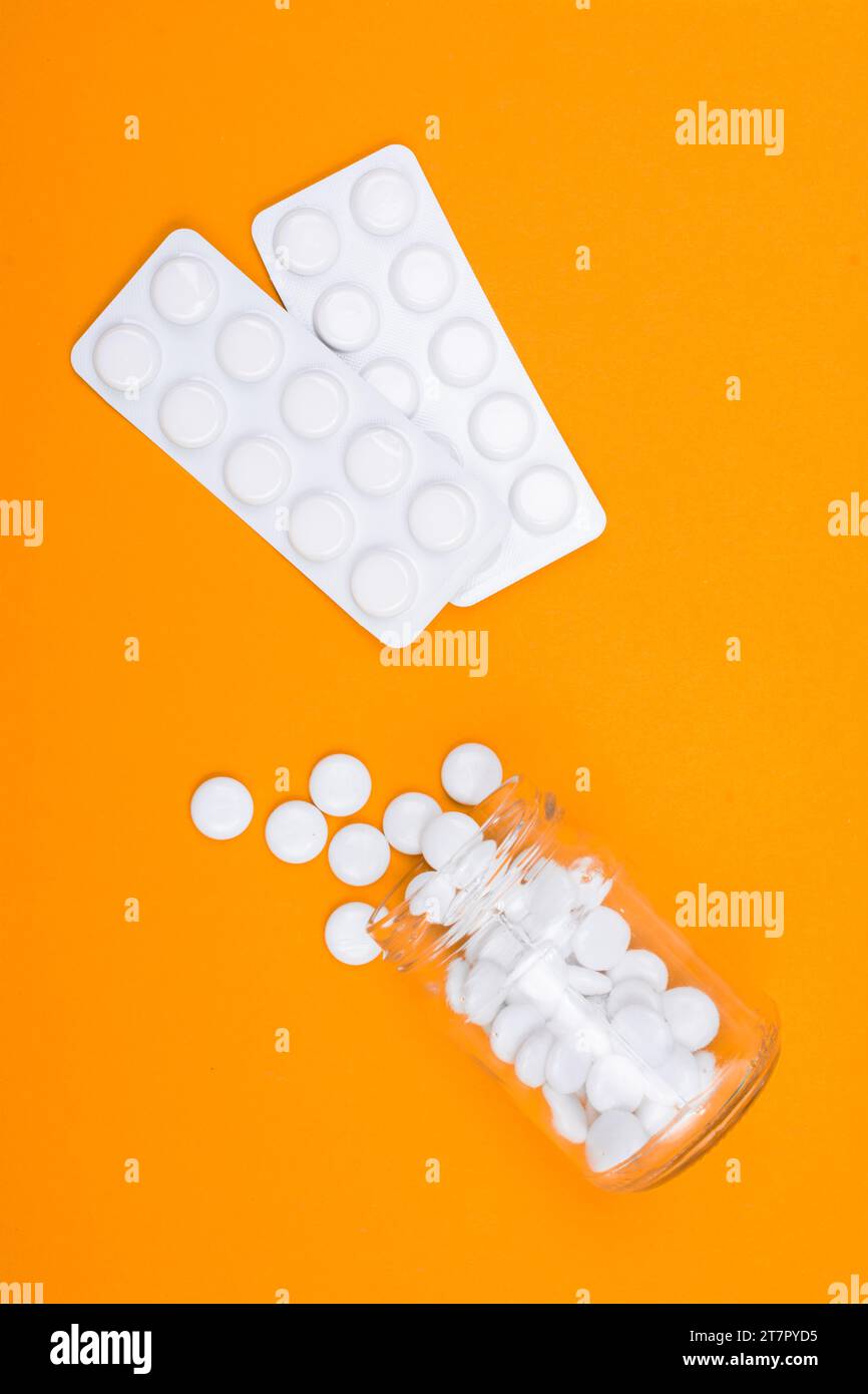 White pill and glass bottle container. Pharmaceutical industry ...
