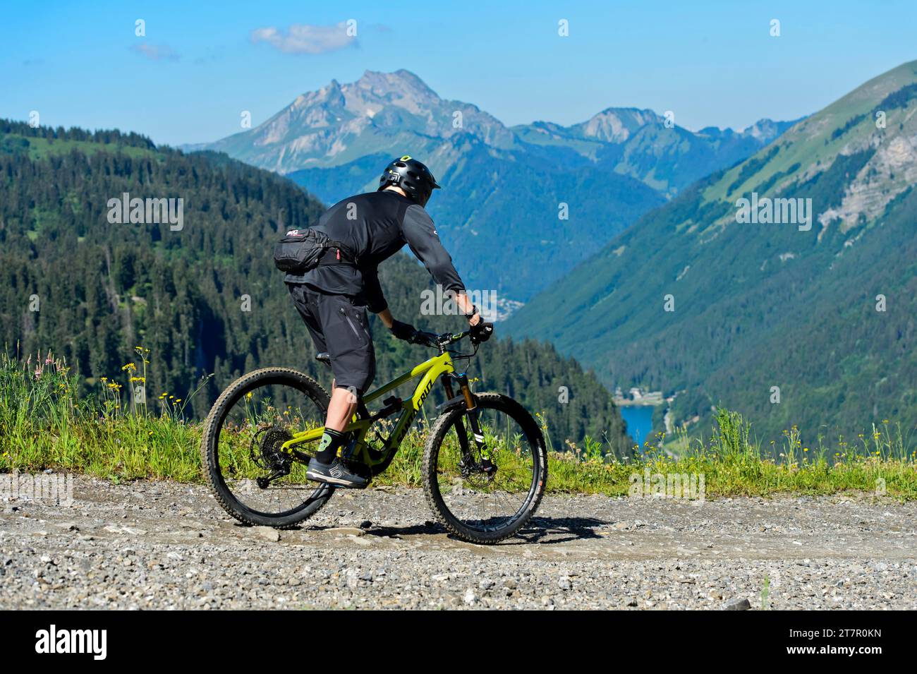 Mountain bikers on an alpine descent in the Chablais Geopark, Montriond ...