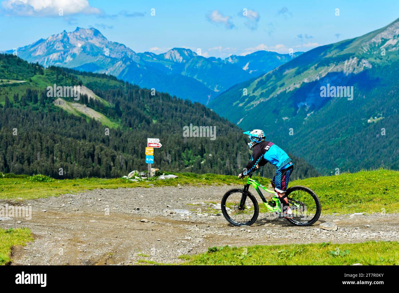 Mountain bikers on an alpine descent in the Chablais Geopark, Montriond ...