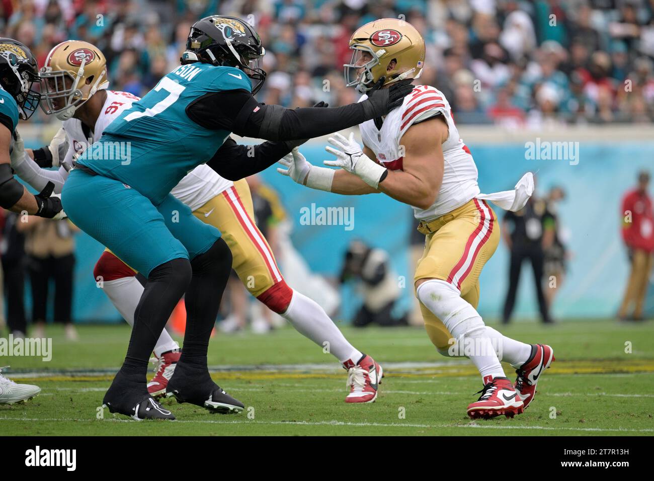 Jacksonville Jaguars offensive tackle Anton Harrison, left, works ...