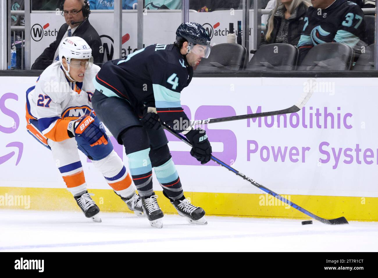 Seattle Kraken defenseman Justin Schultz (4) controls the puck next to ...