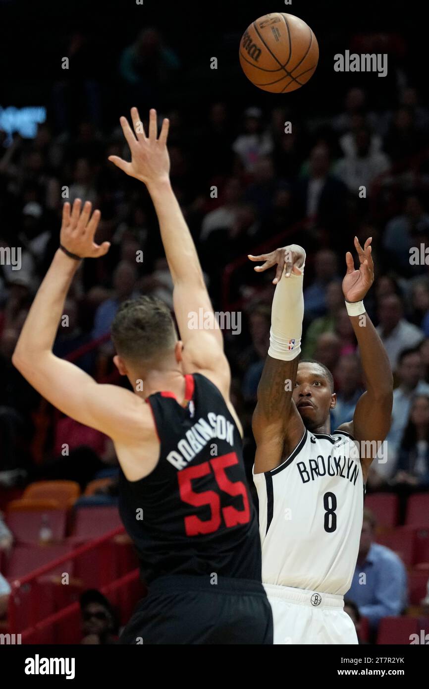 Brooklyn Nets guard Lonnie Walker IV (8) shoots past Miami Heat forward Duncan Robinson (55 ...