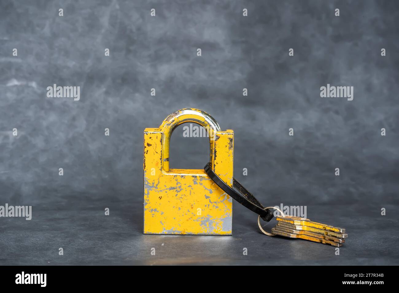 Padlock and keys on black polished floor Stock Photo - Alamy