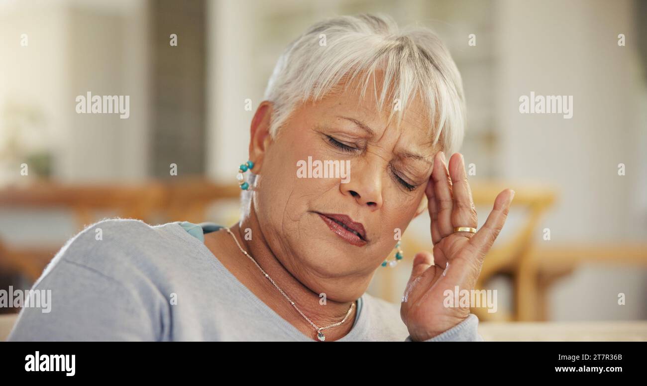 Headache, senior woman and stress in home for retirement, mental health ...