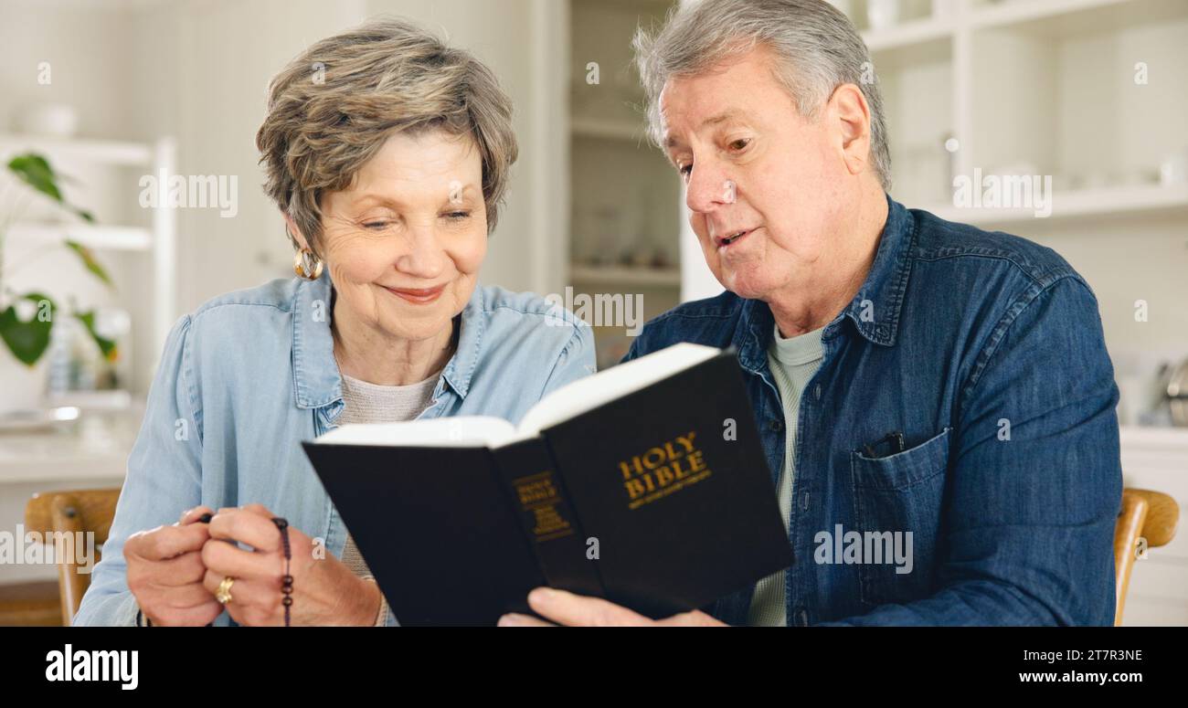 Bible study, reading and senior couple in home with Christian worship ...