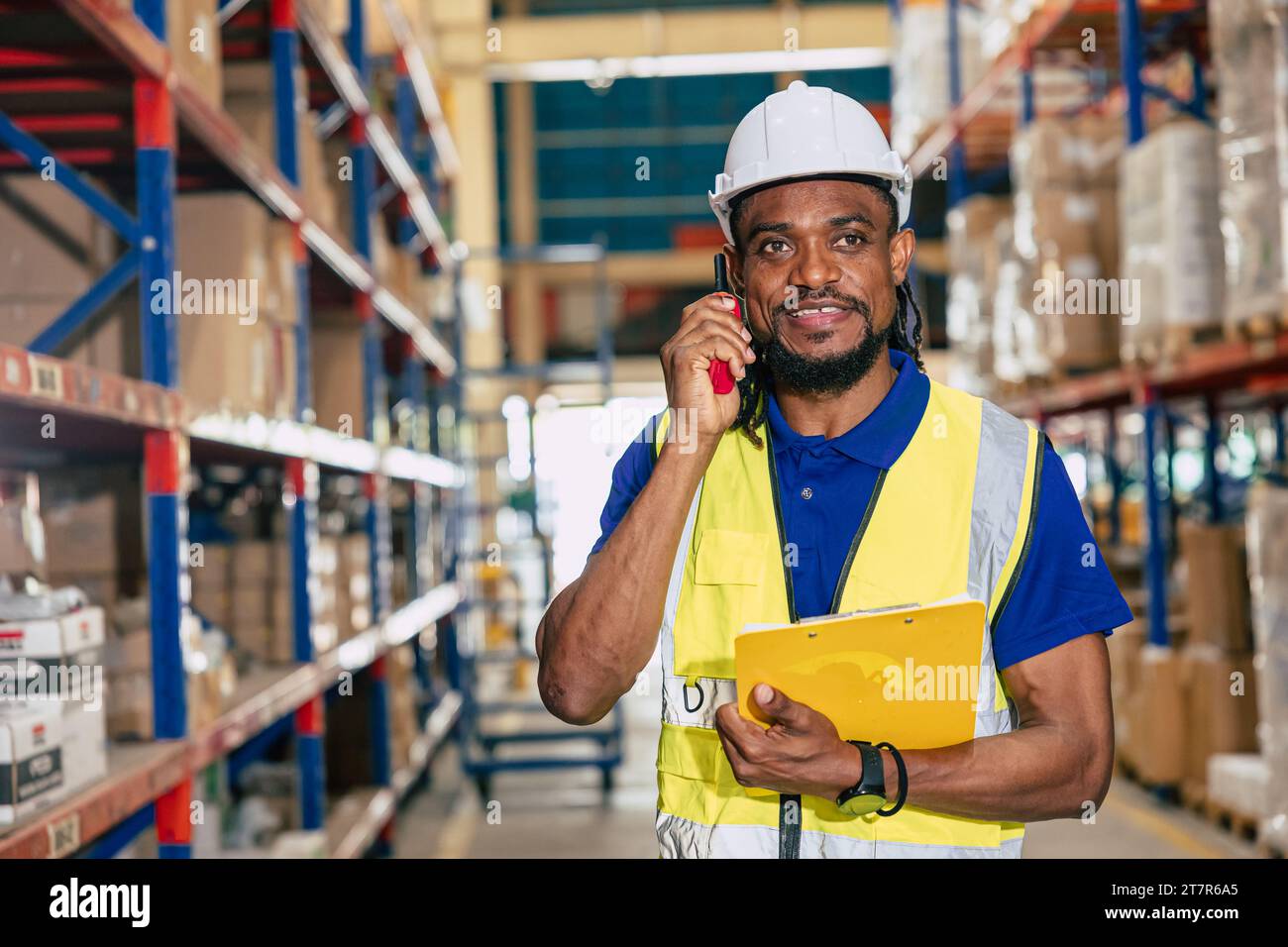warehouse african black male worker. inventory clerk staff working radio control loading check ...
