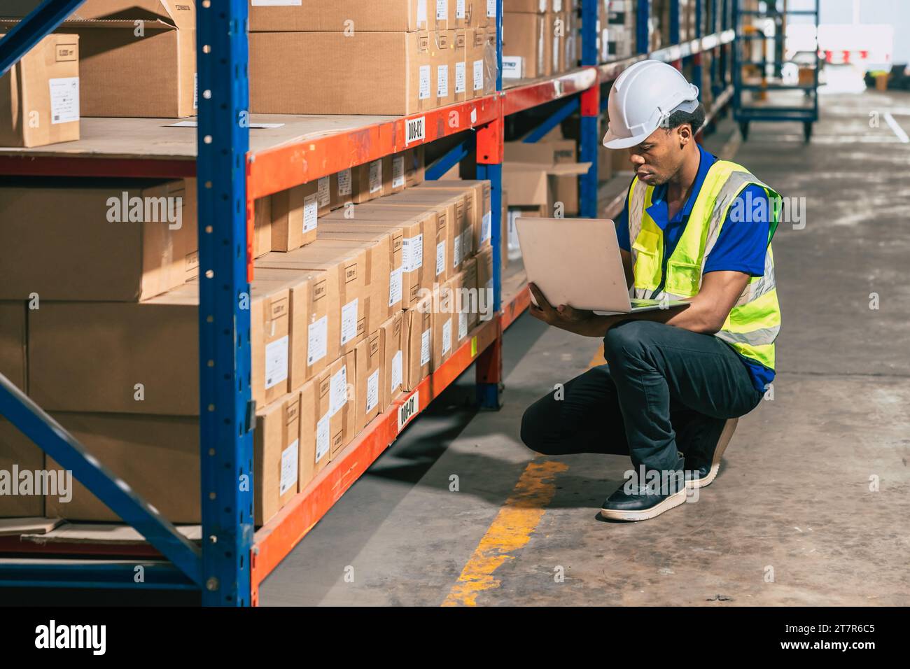 warehouse african black male worker. inventory clerk staff stock employee work in cargo storage ...