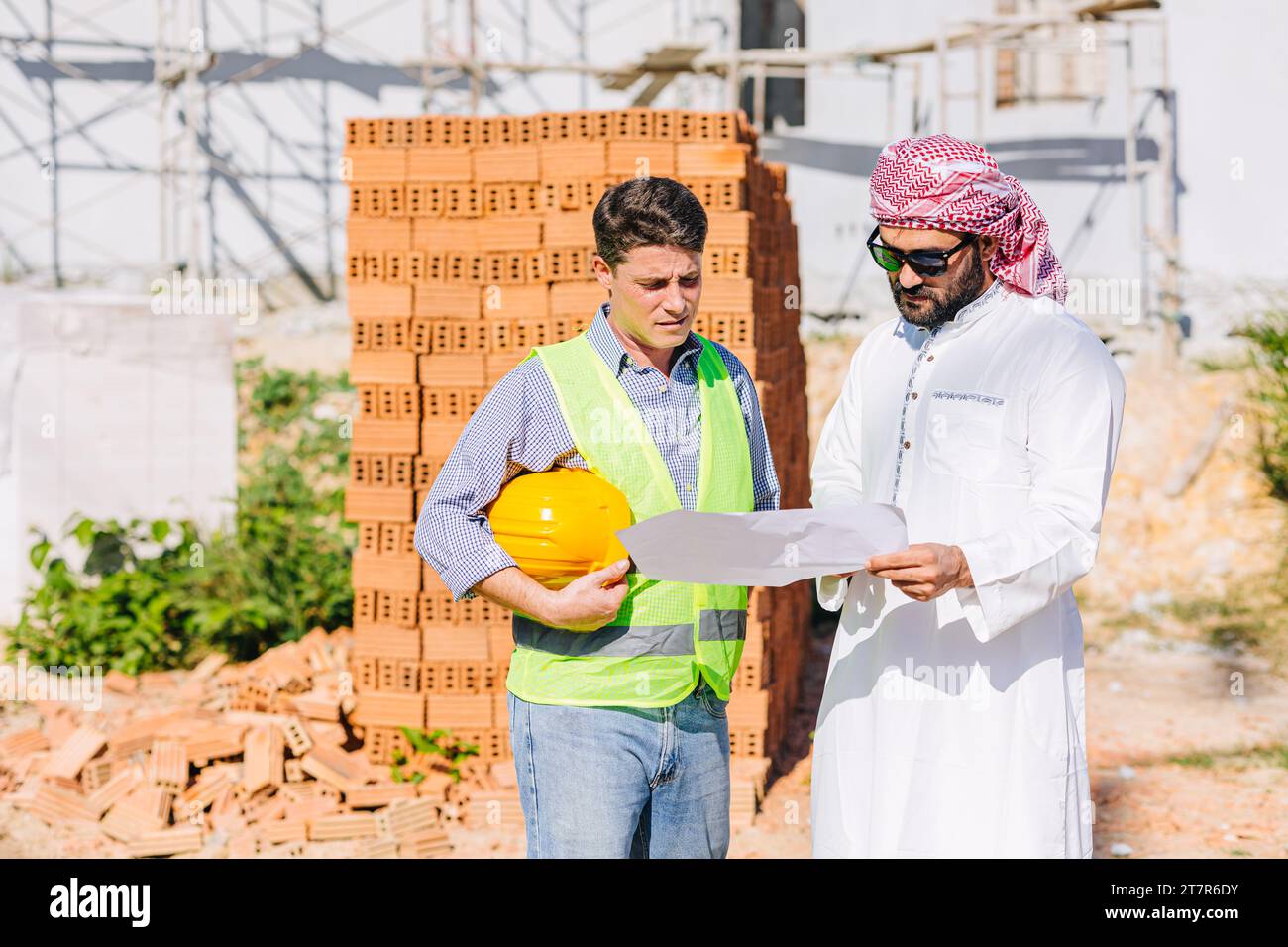 Arab business man working with american engineer builder construction ...